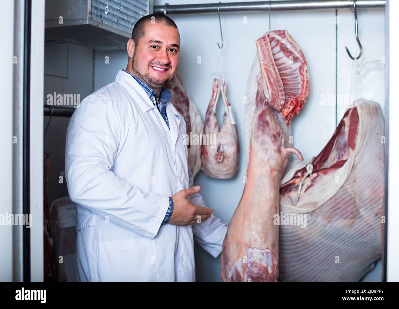 staff selling halal meat Stock Photo - Alamy
