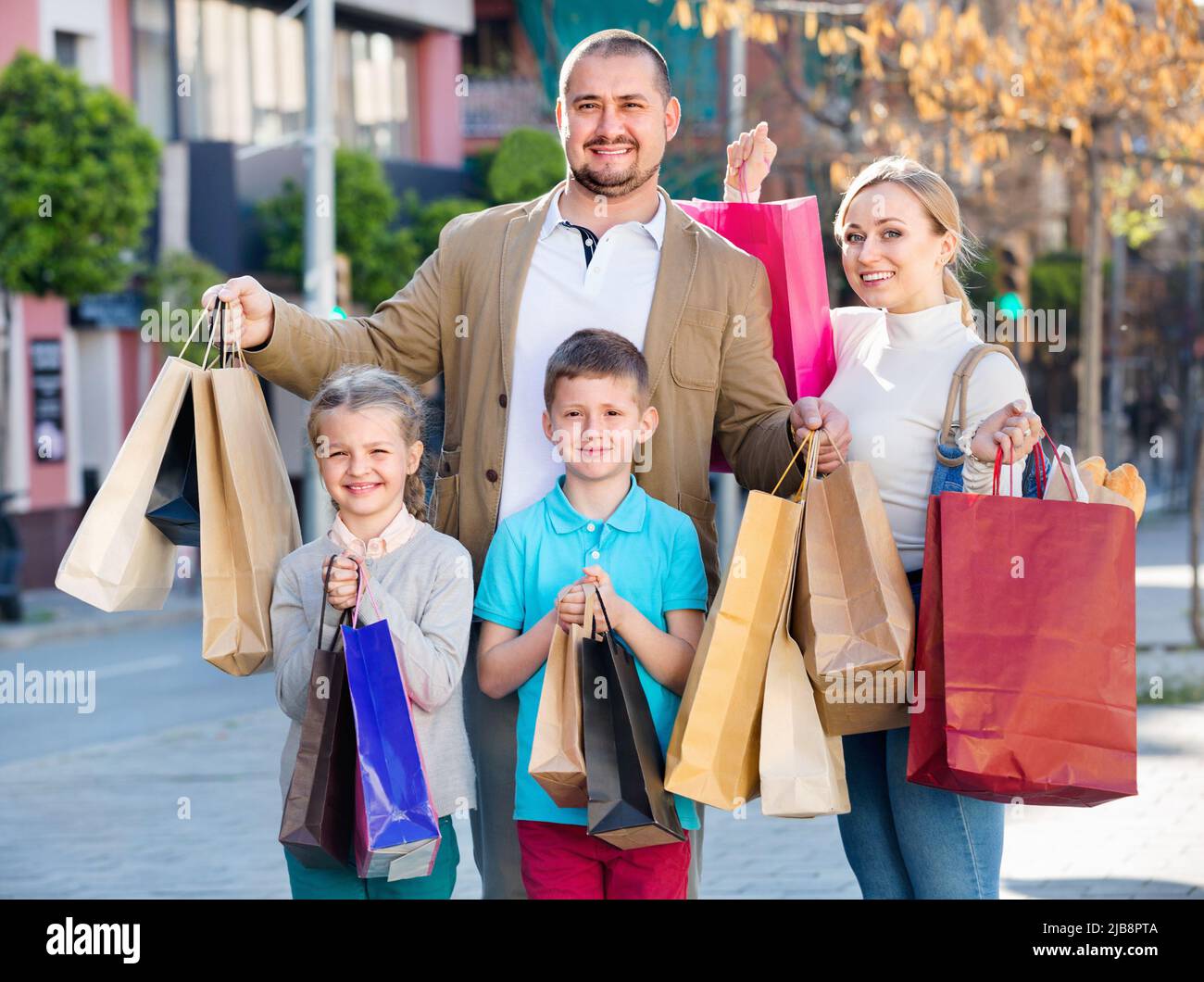 Parents with two teenagers going for shopping outdoors Stock Photo - Alamy