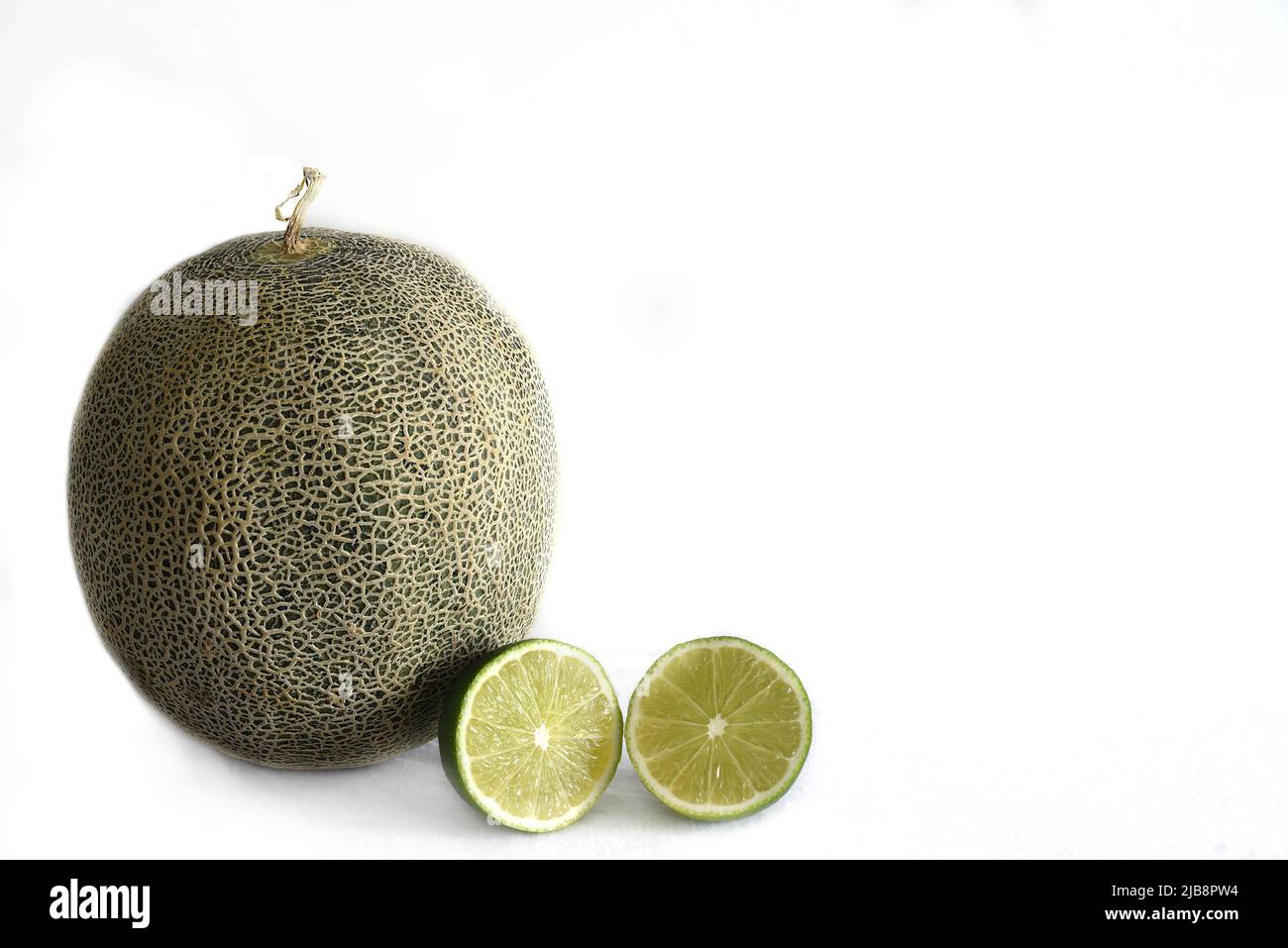 melon fruit and lime on white background Stock Photo - Alamy