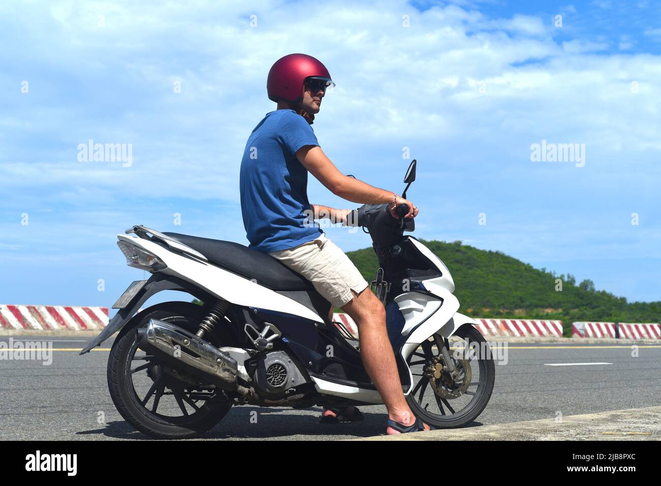 Man holding motorcycle helmet hi-res stock photography and images - Alamy