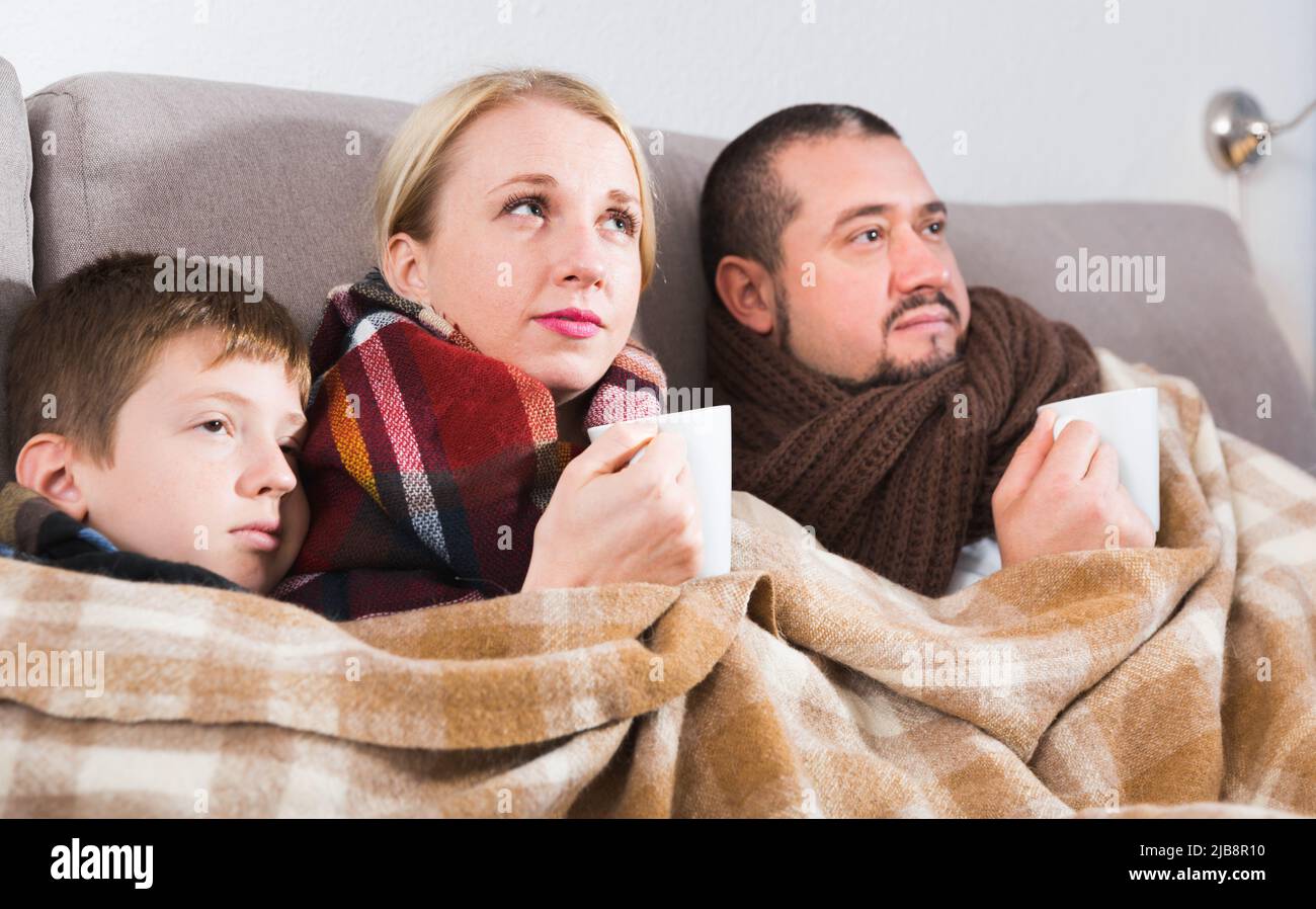 Family with son catching cold Stock Photo - Alamy
