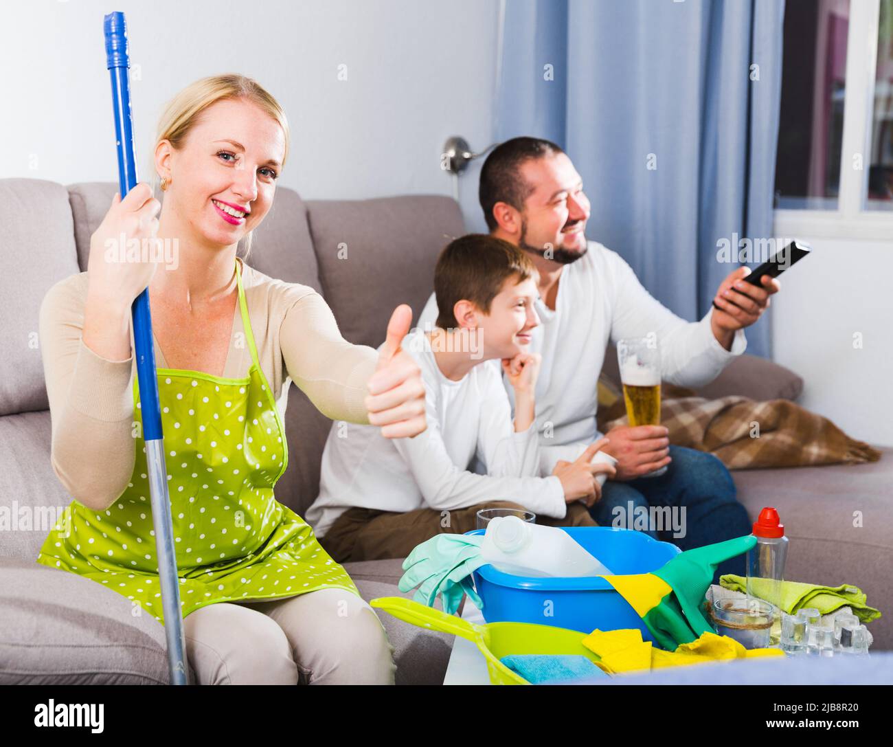 Happy mother ready to cleaning house Stock Photo - Alamy