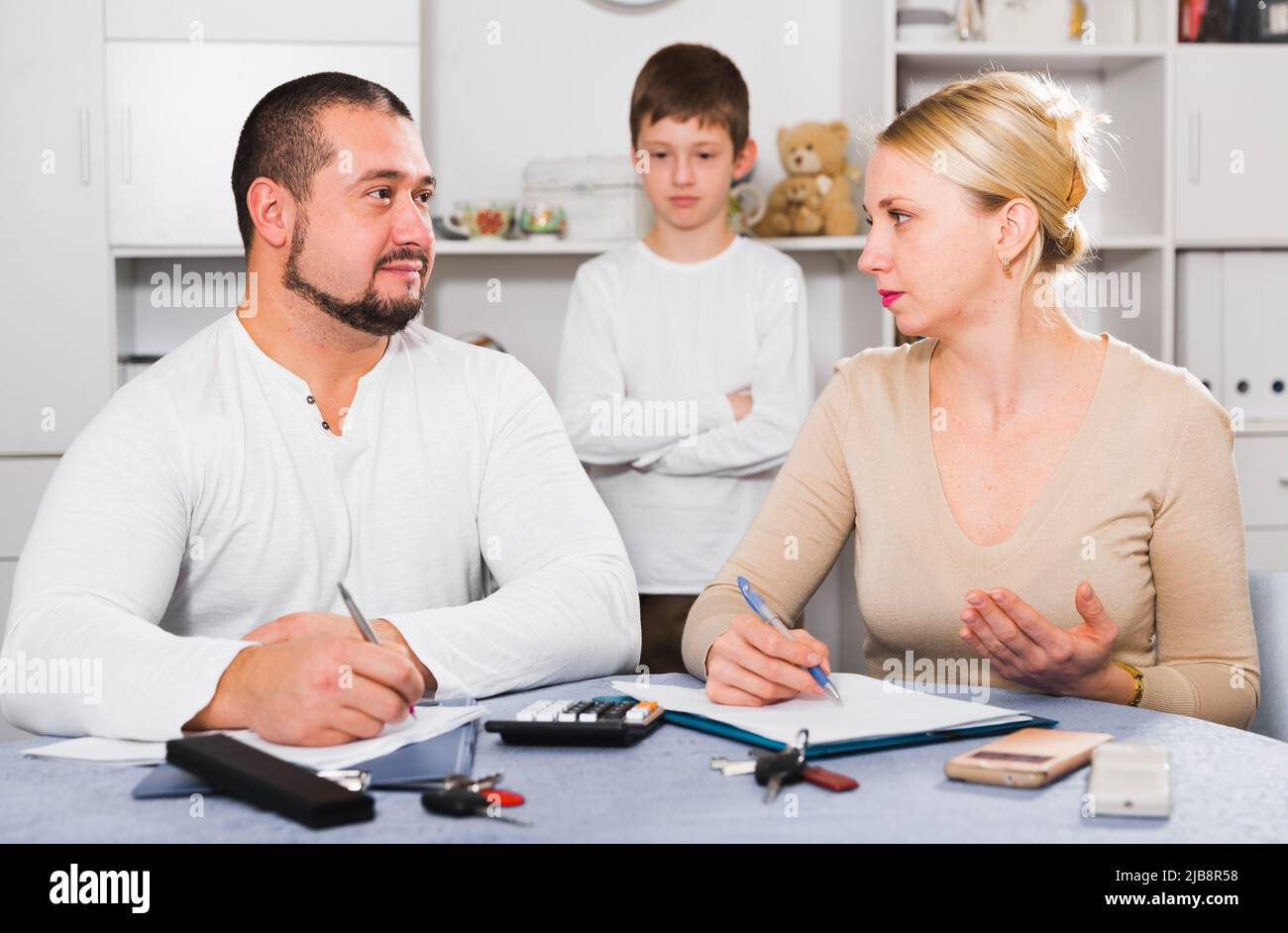 Serious family working with papers Stock Photo - Alamy