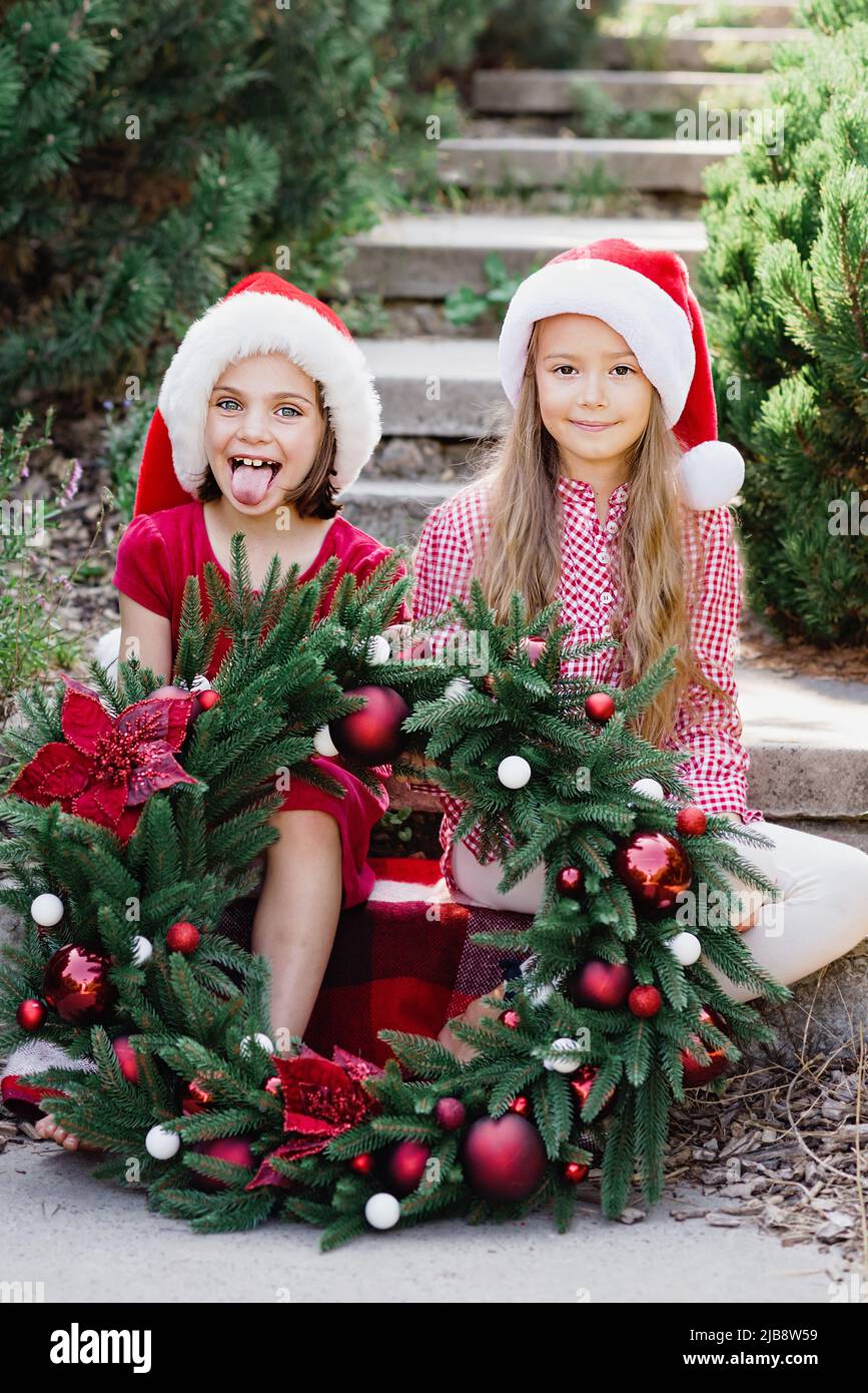Merry Christmas. Portrait of two happy funny children girls in Santa ...