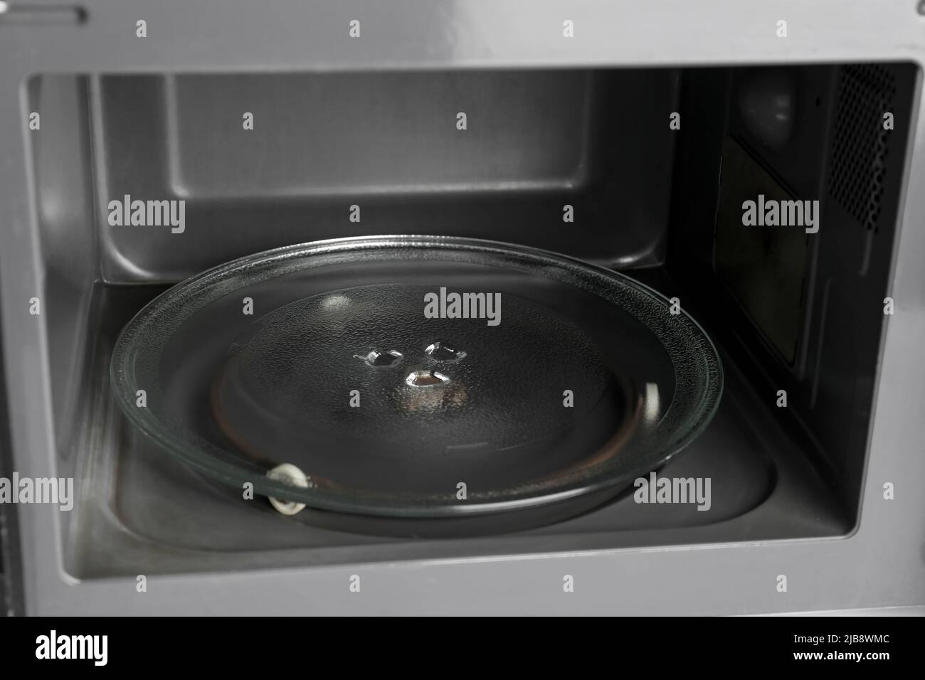 Modern open microwave oven, closeup Stock Photo - Alamy