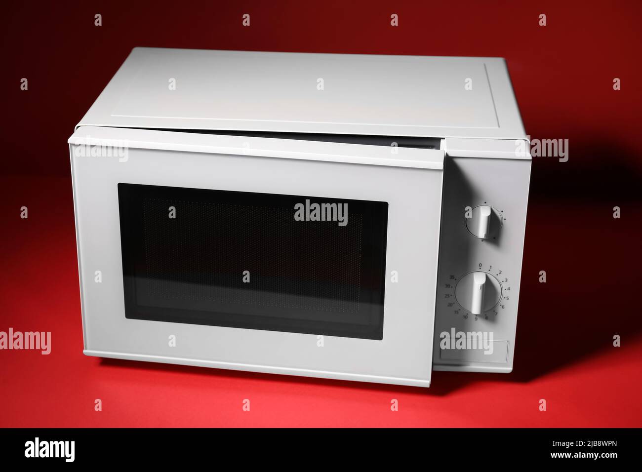 Red color microwave oven hi-res stock photography and images - Alamy