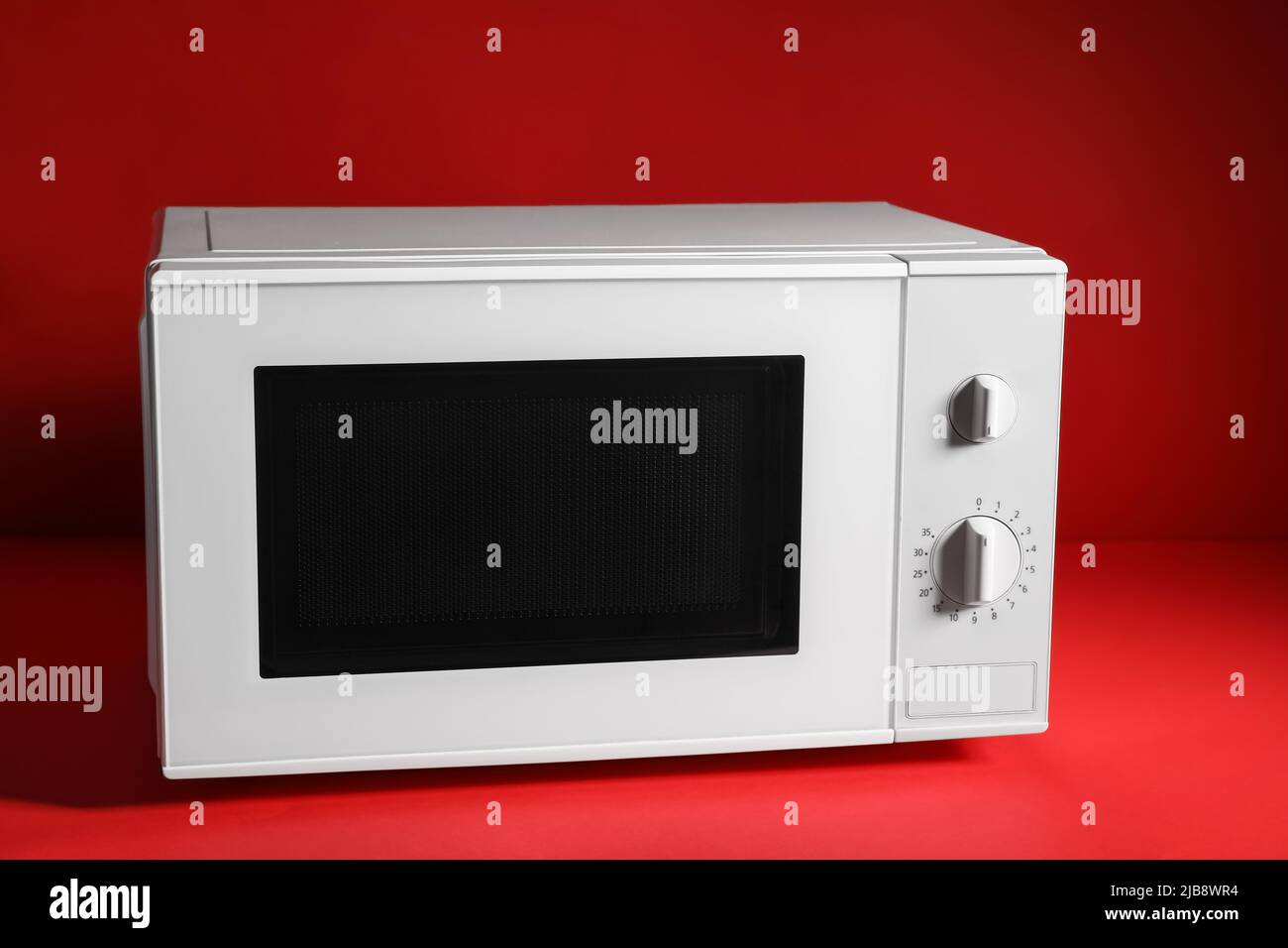 Red color microwave oven hi-res stock photography and images - Alamy