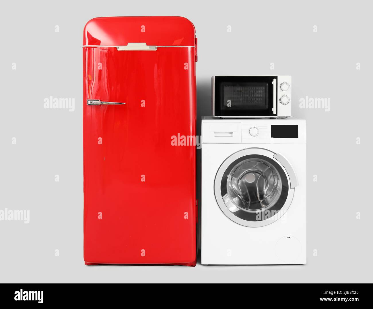Modern household appliances on light background Stock Photo - Alamy