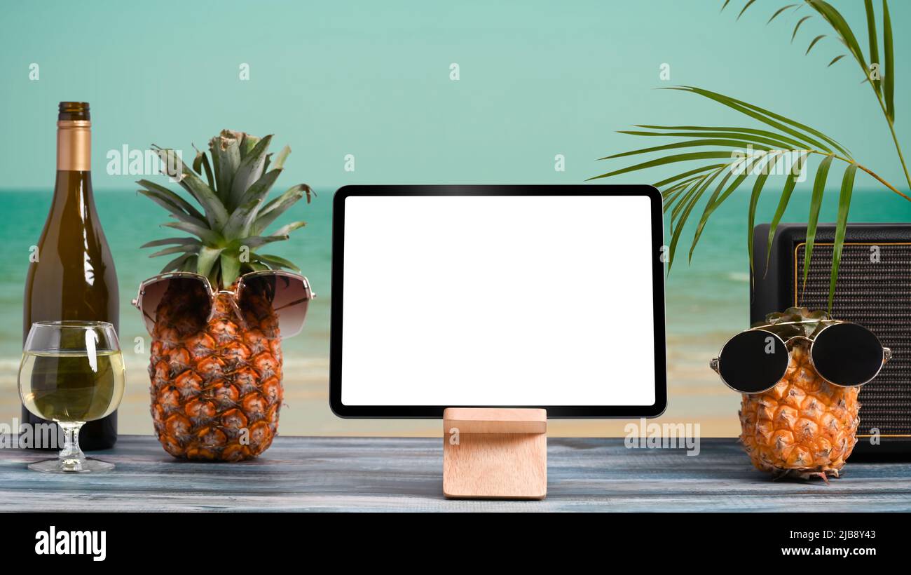Mockup digital tablet and summer drinks on wooden table with tropical ...