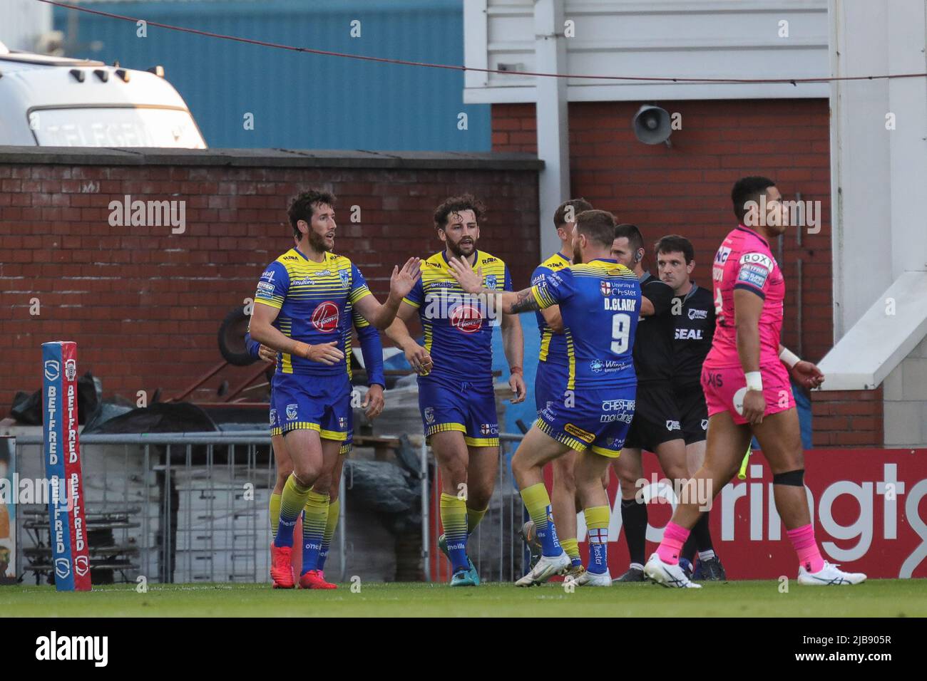 Matty Ashton #5 of Warrington Wolves celebrates his try with his team ...