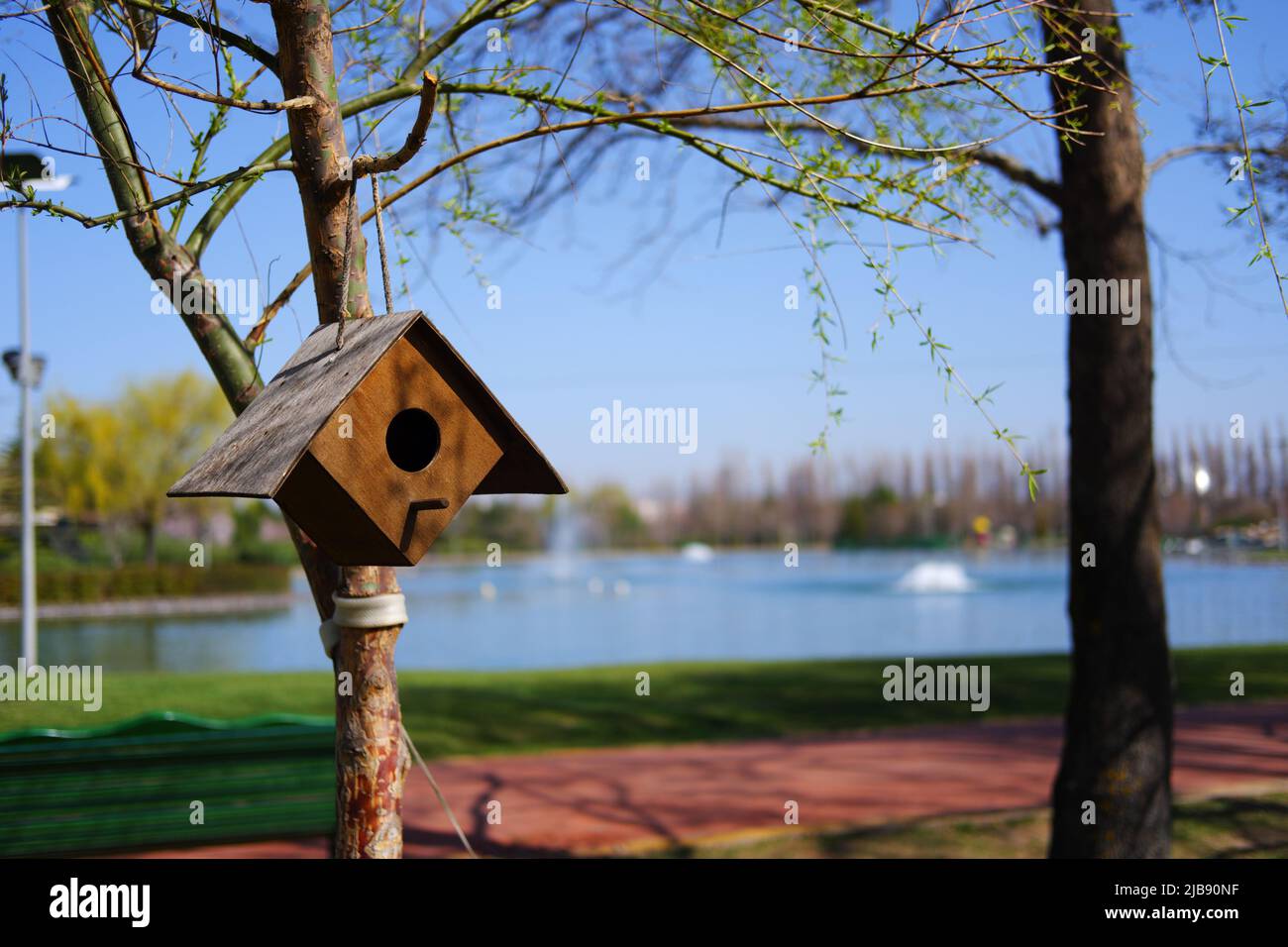 Wooden Bird-house at park lakeside Stock Photo - Alamy