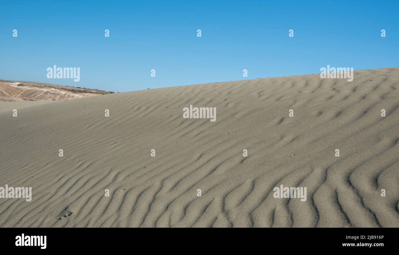 Sand dunes against blue sky. Desert dry coast land Cyprus Stock Photo ...
