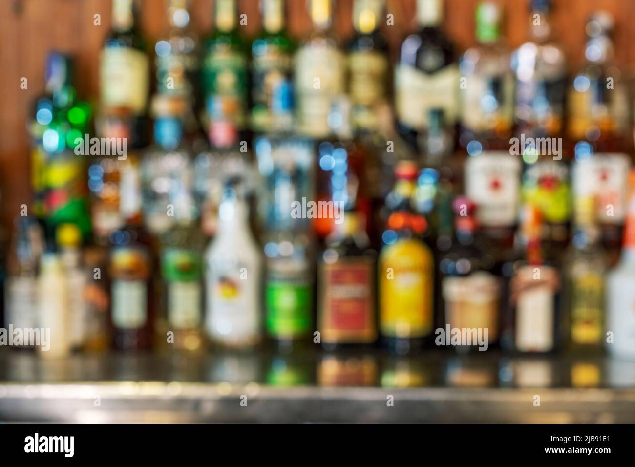 Metal table with alcohol bar background. The photo is blurry Stock ...