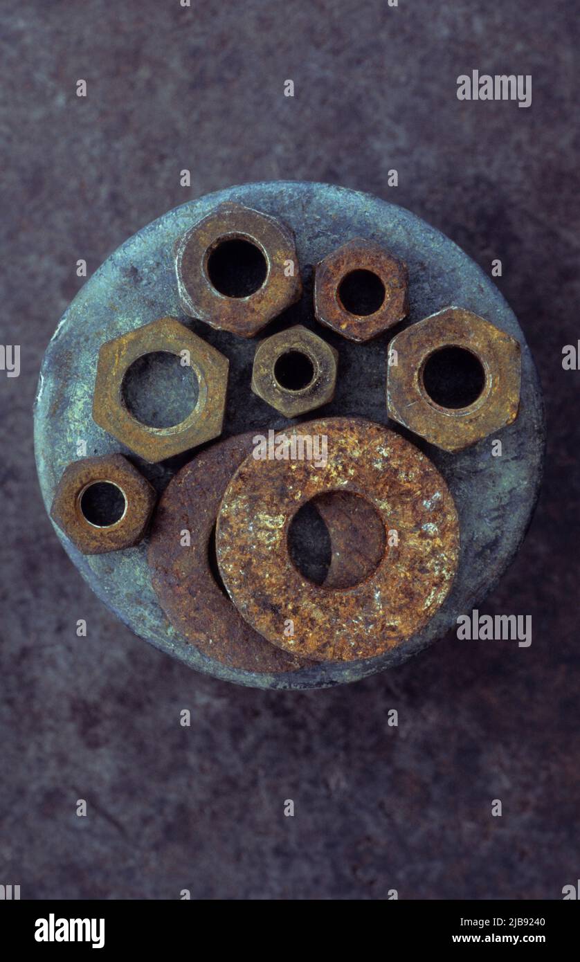 Used rusty metal nuts and washers lying on tarnished metal Stock Photo ...