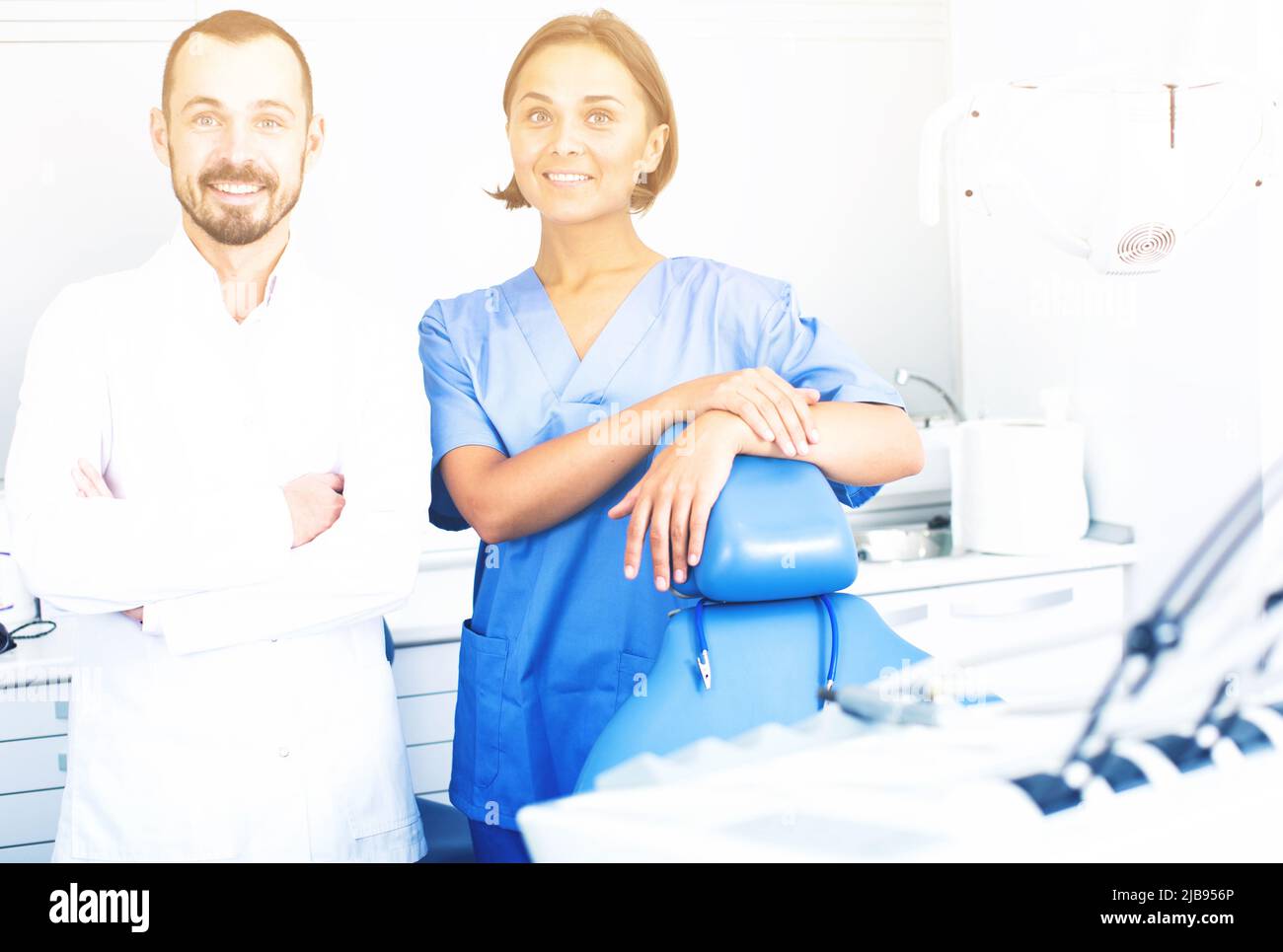 Assistant and doctor are meeting next client Stock Photo - Alamy