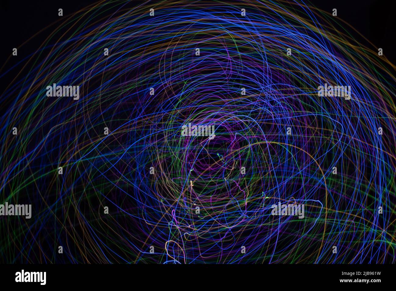 Light painting Abstract colorful irregular lines or patterns on black ...