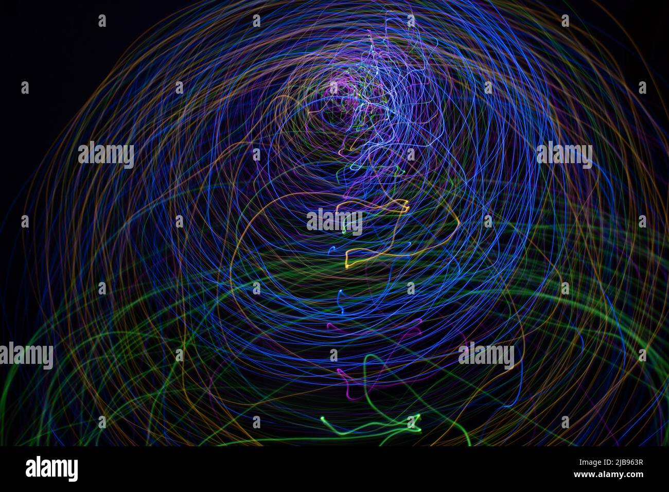 Light painting Abstract colorful irregular lines or patterns on black ...