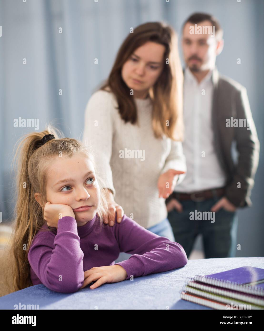 Parents lecturing daughter Stock Photo - Alamy