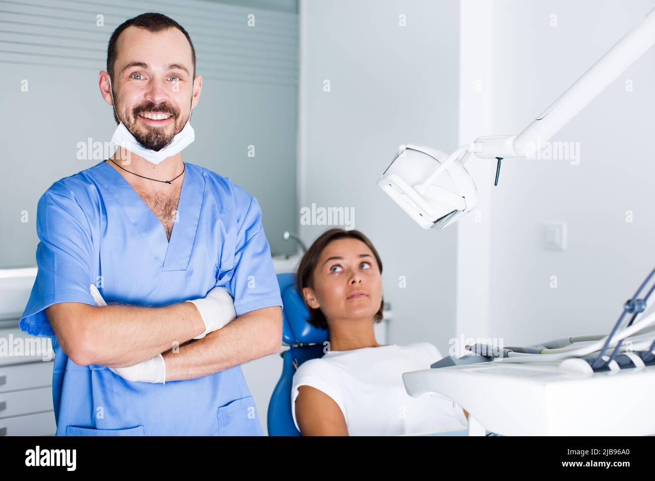 Dentist is ready to treating client woman in dental clinic Stock Photo ...