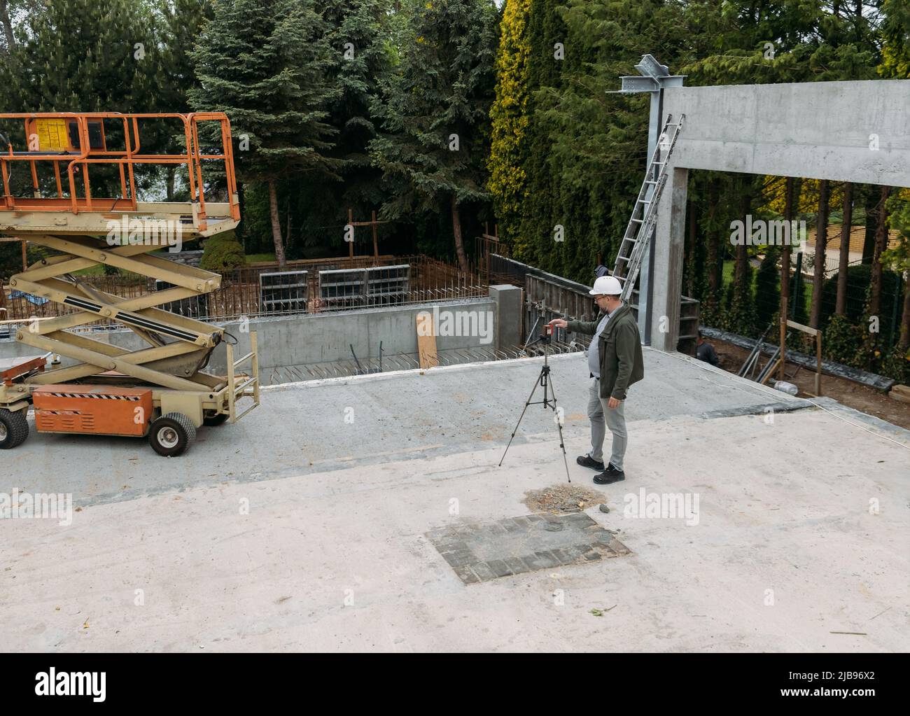 Geodetic works. Surveyor engineer using geodetic equipment at ...