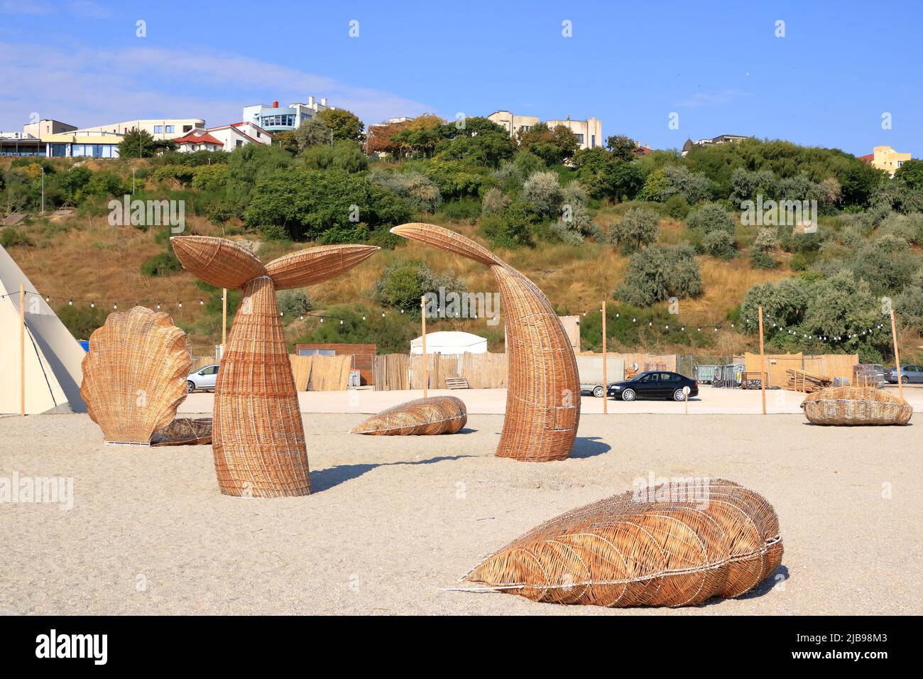 art made of straw at beach with tourists in summer in Constanta ...