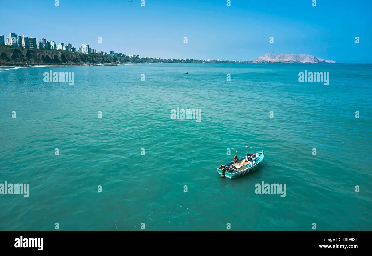 Scenic view of traditional fishing boats in the bay of Lima, Peru. Self ...