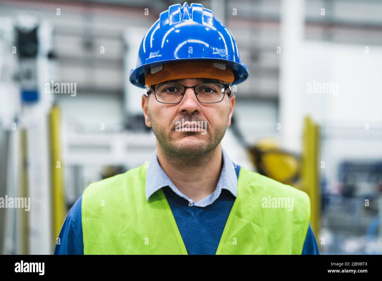 Engineer man working inside robotic factory - Tech industry concept ...