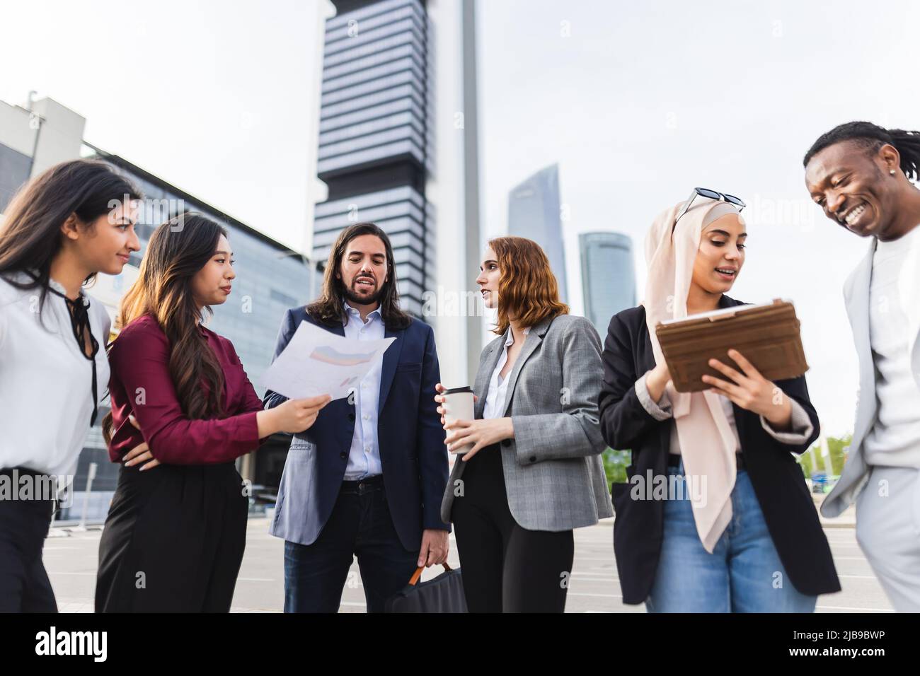Multiracial business people having a briefing outside the officet Stock ...