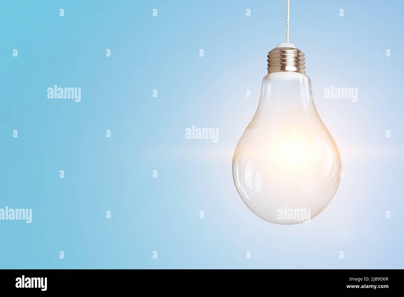 Light bulb on light blue background Stock Photo - Alamy