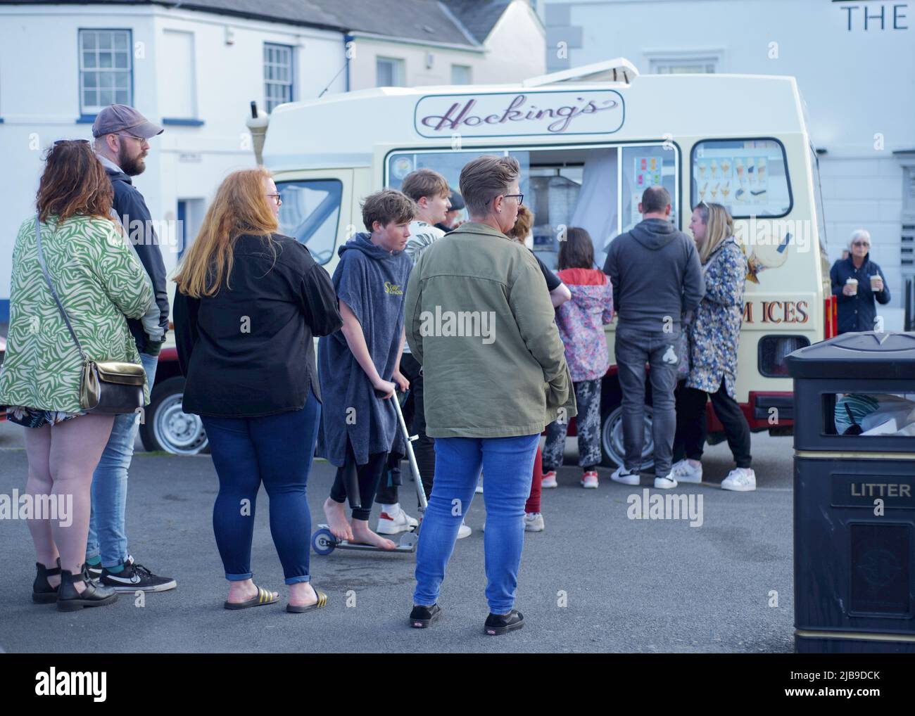 People queuing for ice cream from a traditional ice cream van in ...