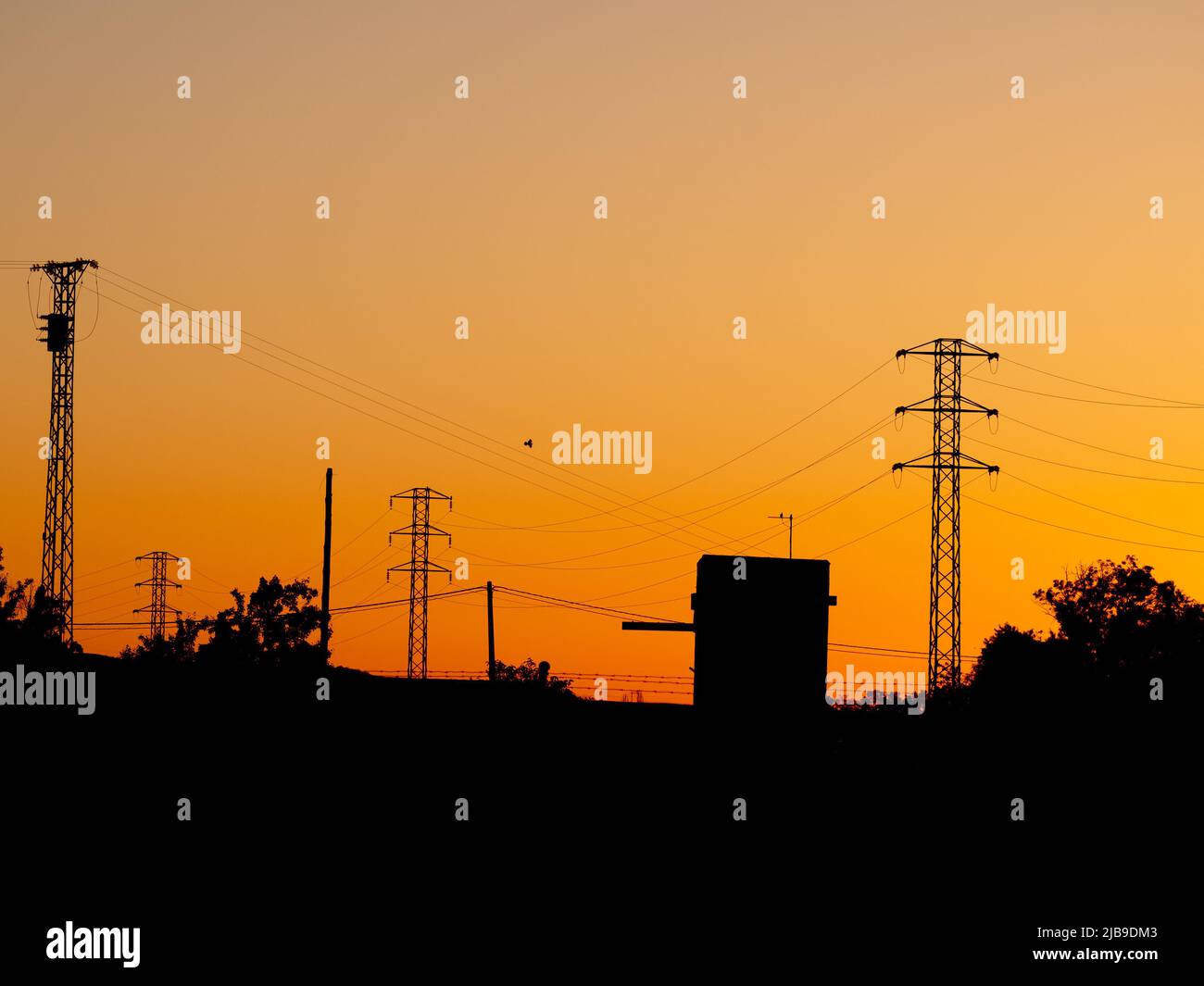 Electricity tower in the light of sunset on a plain. hq photo Stock ...