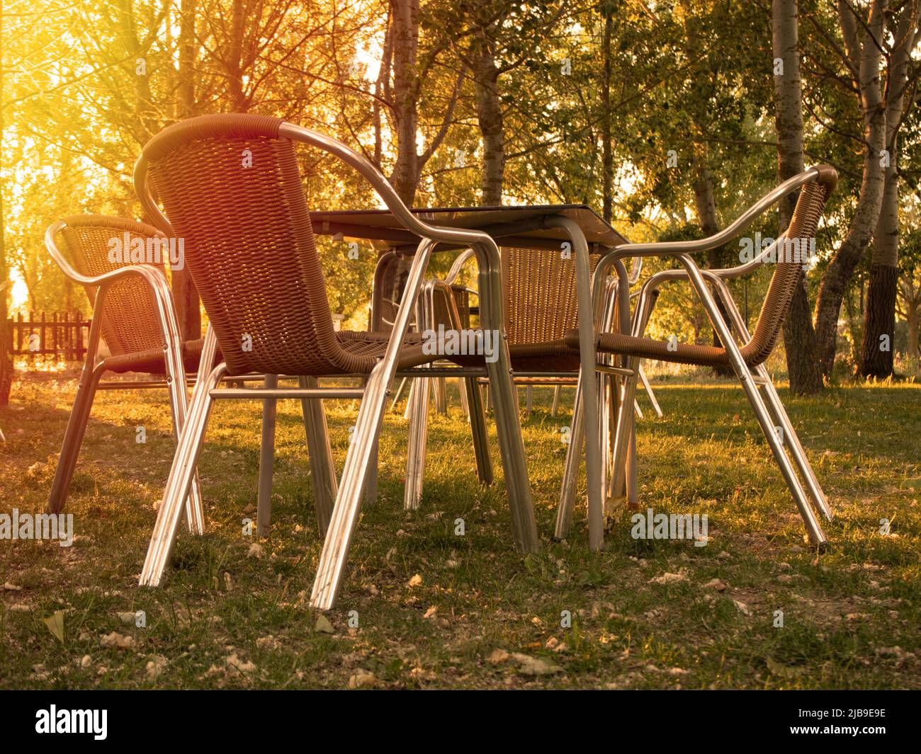 Chairs and tables stacked in a closed nature cafe. High quality photo ...