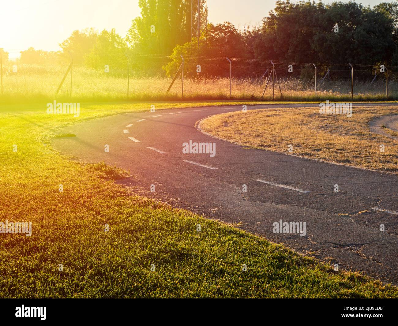 Running track in a public park at sunrise in summer..High quality photo ...