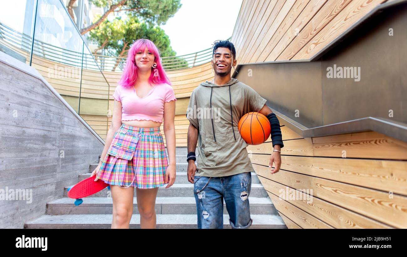 Alternative Diverse Couple Hanging Out Together Chilling And Smiling