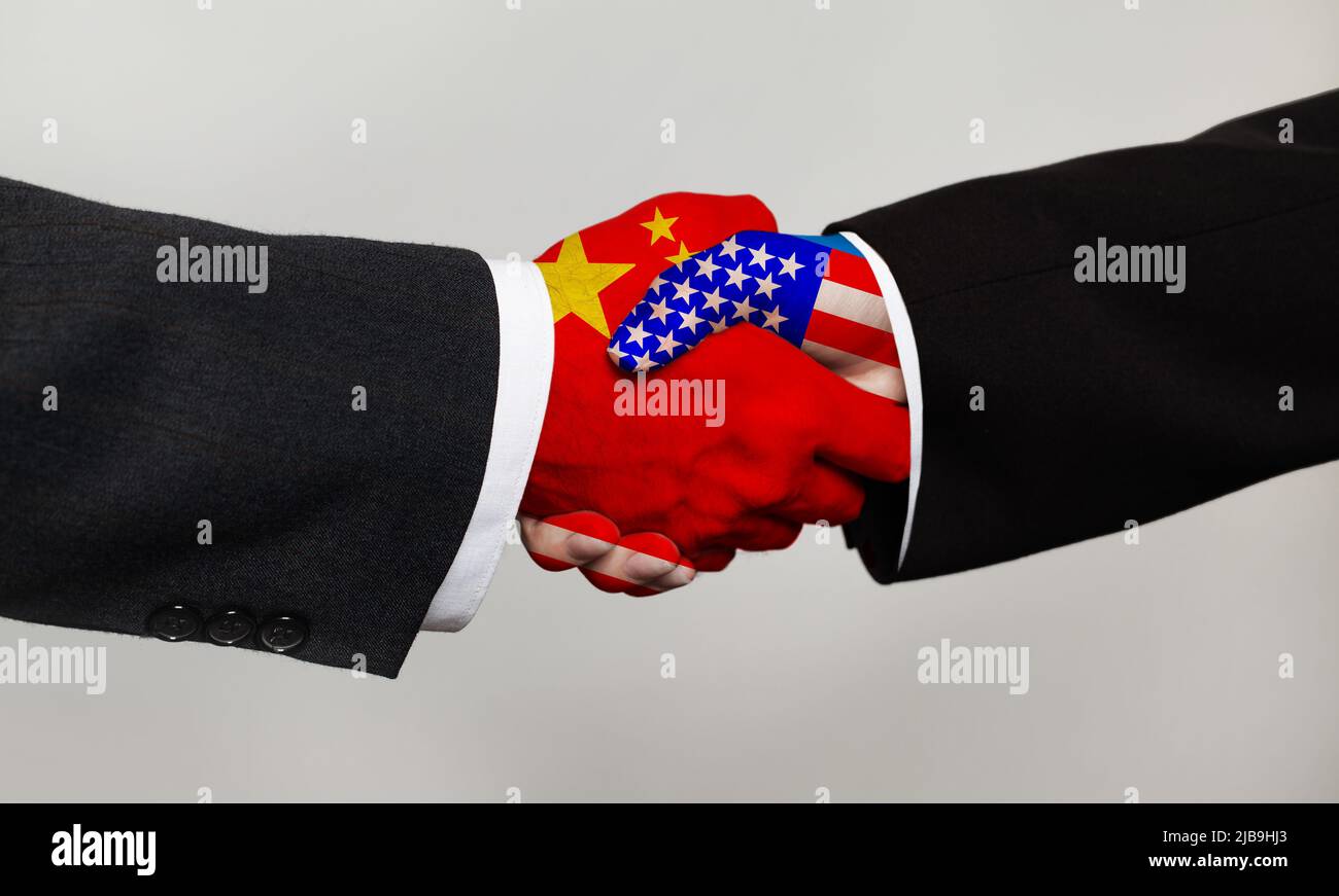 USA and China negotiation and cooperation concept. Handshake with ...
