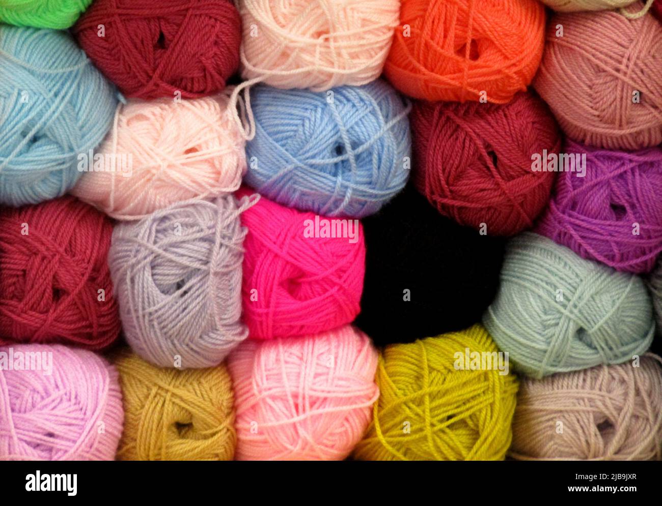 A Display of Brightly Coloured Knitting Wool Balls Stock Photo - Alamy