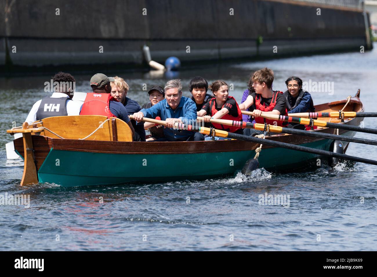 Labour leader Sir Keir Starmer helps to row a boat on the River Lea ...