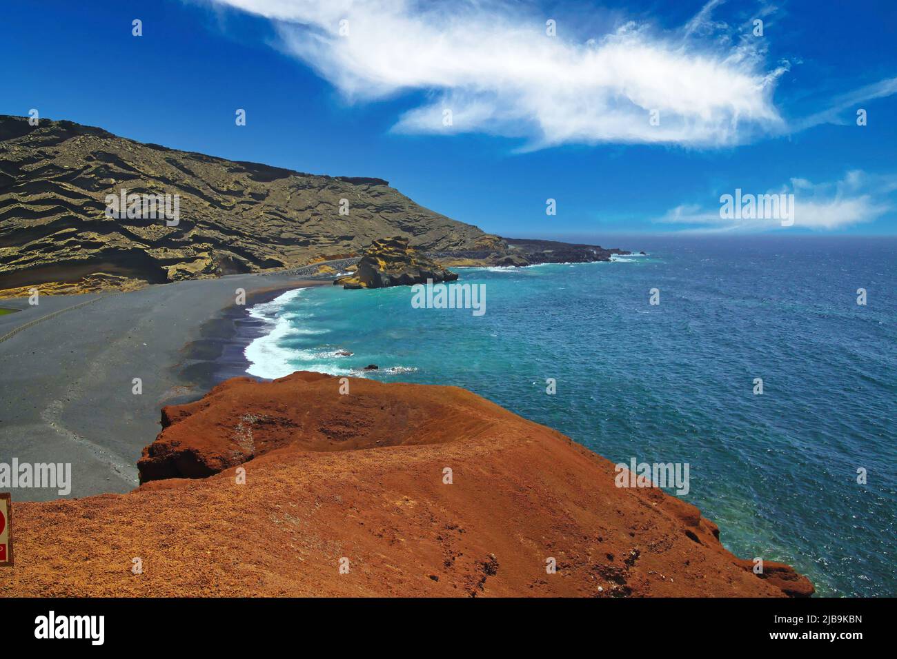 Beautiful secluded lagoon surrounded by impressive rugged weathered ...