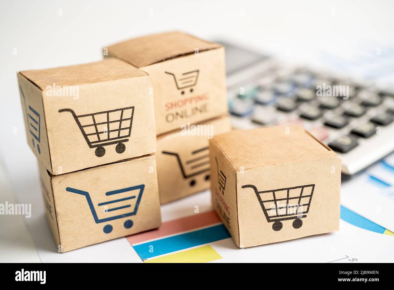 Shopping online box with credit card and calculator on graph. Finance ...