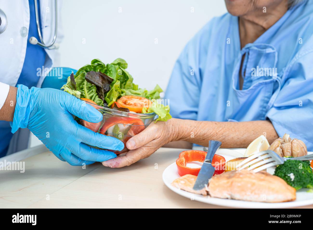 Asian senior or elderly old lady woman patient eating breakfast ...