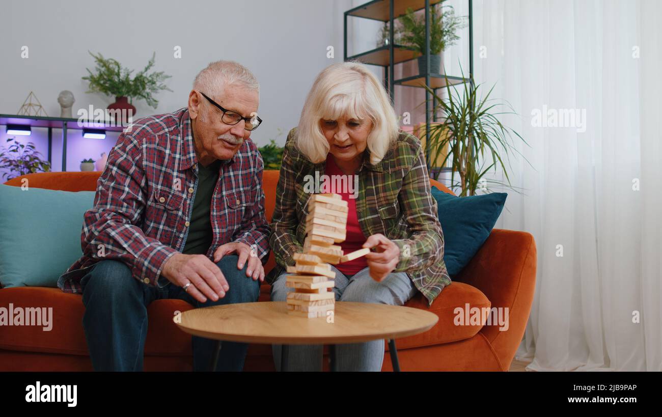 Old senior mature family couple grandparents man woman playing in ...