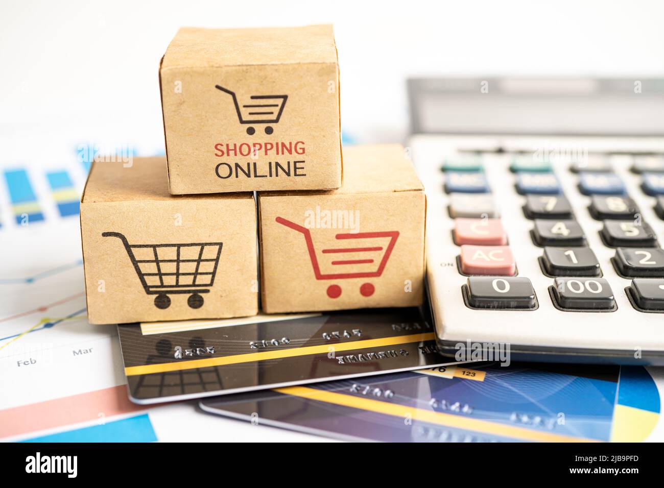 Shopping online box with credit card and calculator on graph. Finance ...