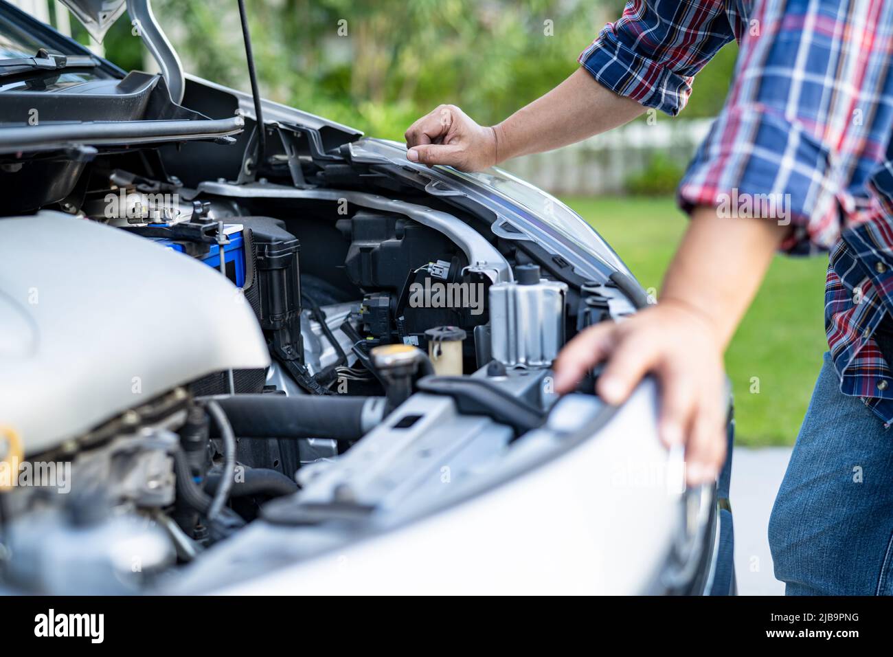 Open hood mechanic engine system to check and repair damage car crash ...