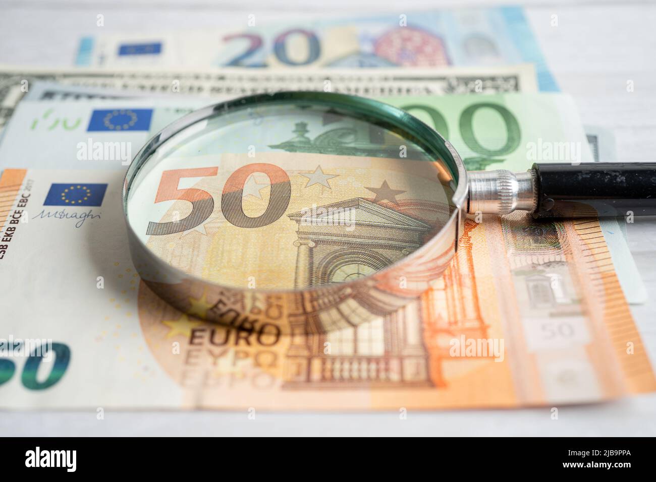Magnifying glass with EU banknotes background, Banking Account ...