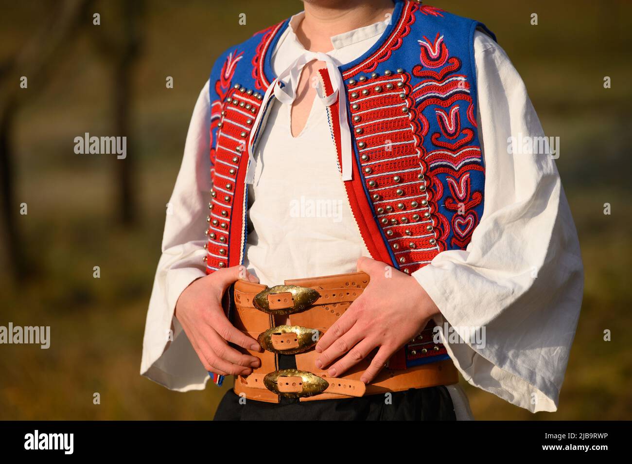 A man dressed in a traditional folk costume. Slovak costume in autumn ...