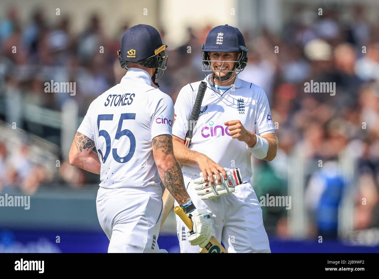 Joe Root of England smiles as he welcomes back Ben Stokes of England ...