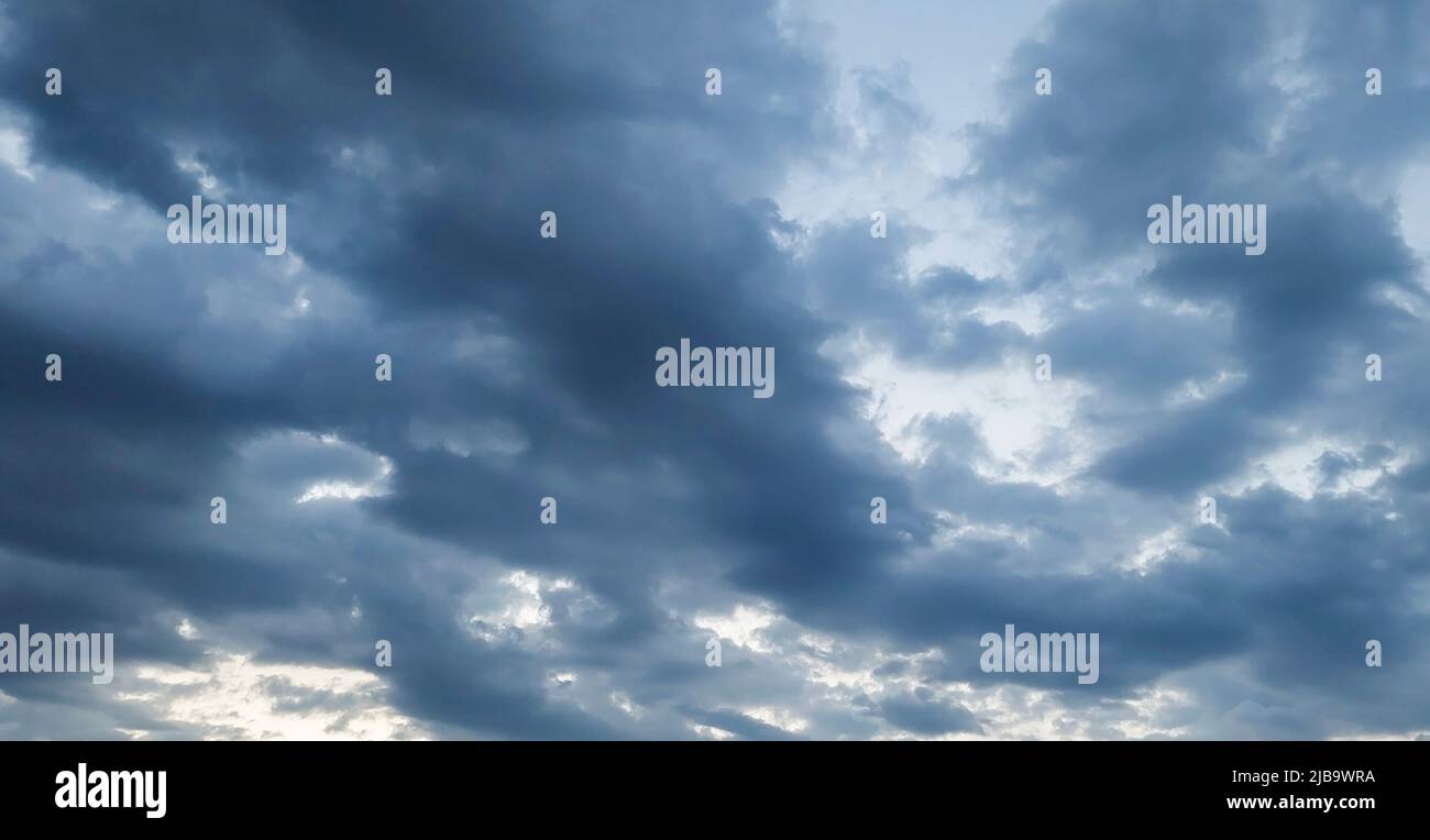 Background with blue sky and dark storm cumulus clouds hi-res stock ...