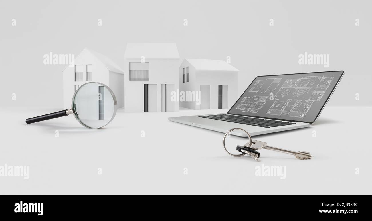 magnifying glass on architectural model of houses with computer laptop ...