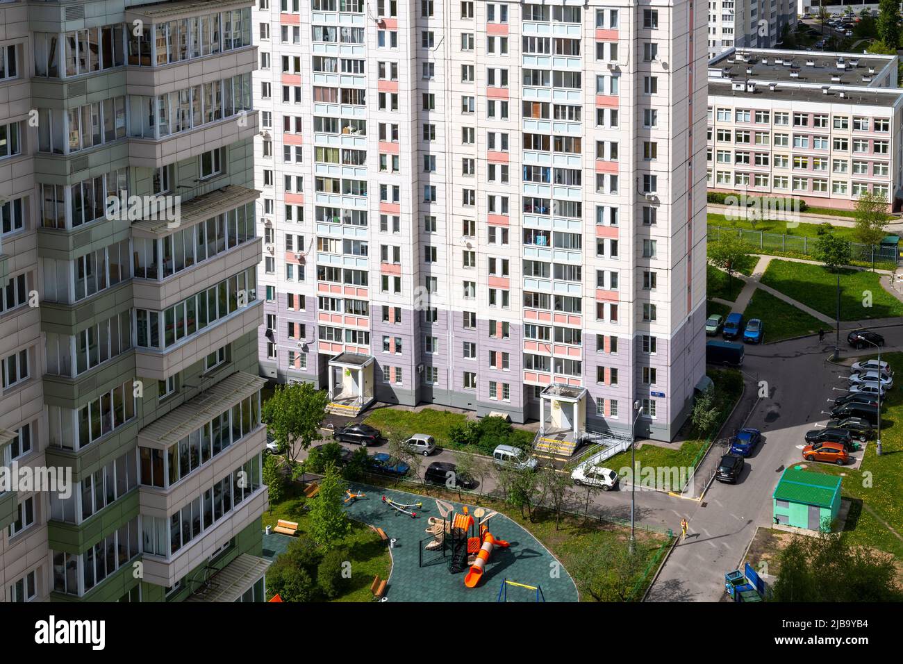 Moscow, Russia - May 29. 2022. Ordinary city yard with cars on a top ...