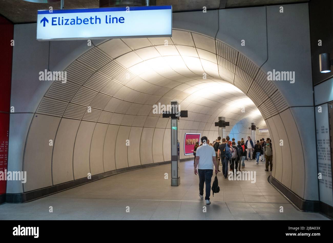 Passengers walk through a passageway in London's newest undergound line ...